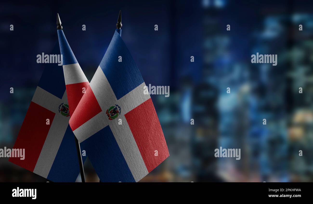 Small flags of the Dominicana on an abstract blurry background Stock ...