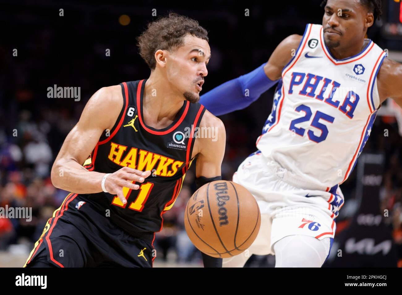 Atlanta Hawks guard Trae Young, left, drives against Philadelphia 76ers ...