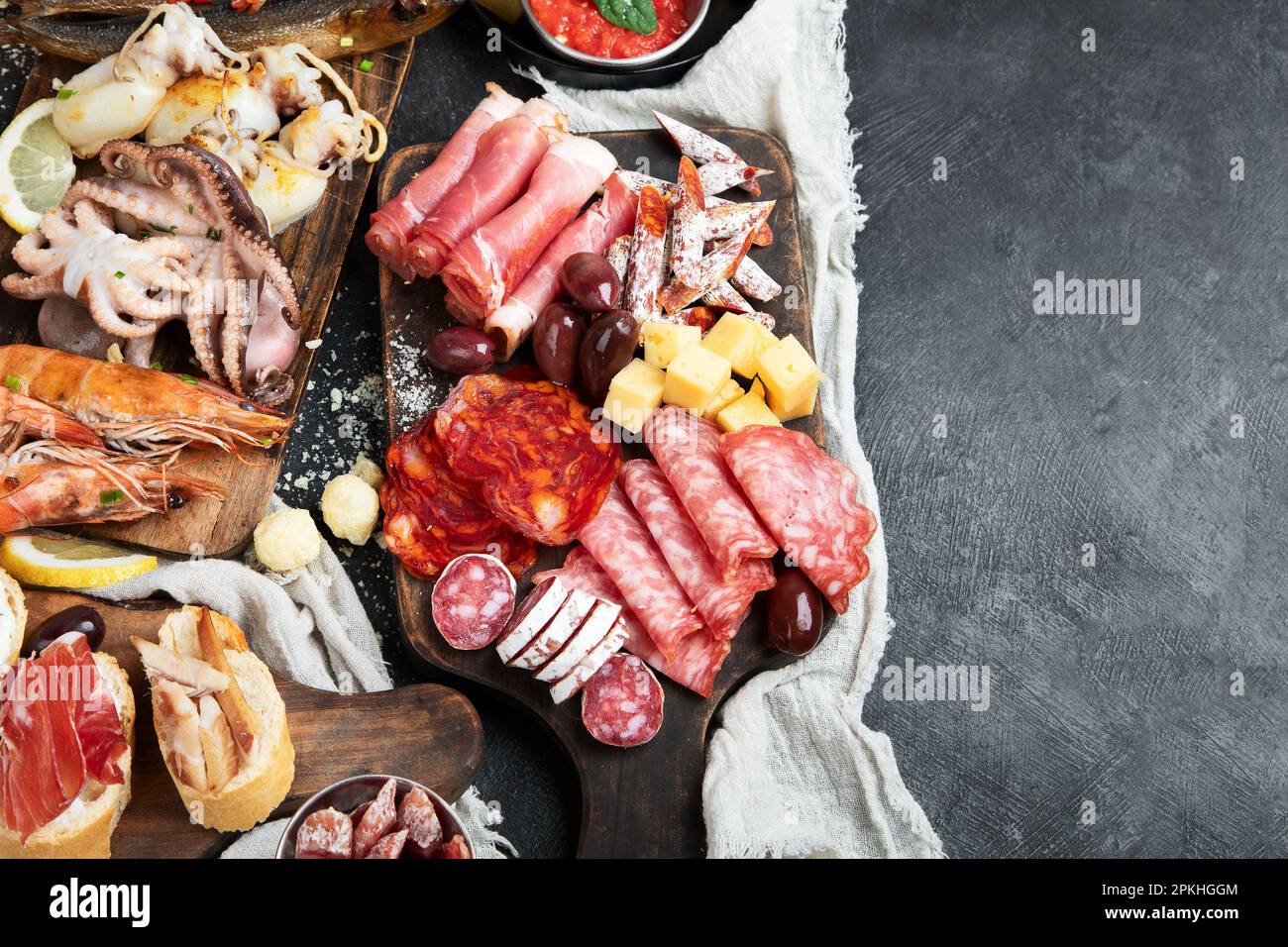 Typical spanish tapas with jamon slices, chorizo, salami, olives ...