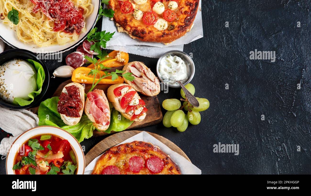 Italian food dishes on dark background. Traditional italian cuisine ...