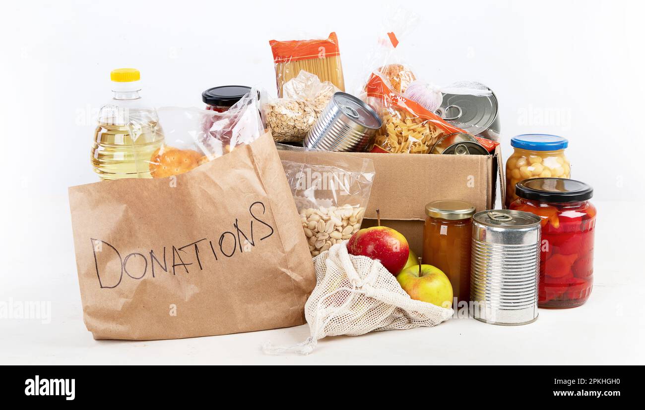 Food donation box of different products on light background, top view ...