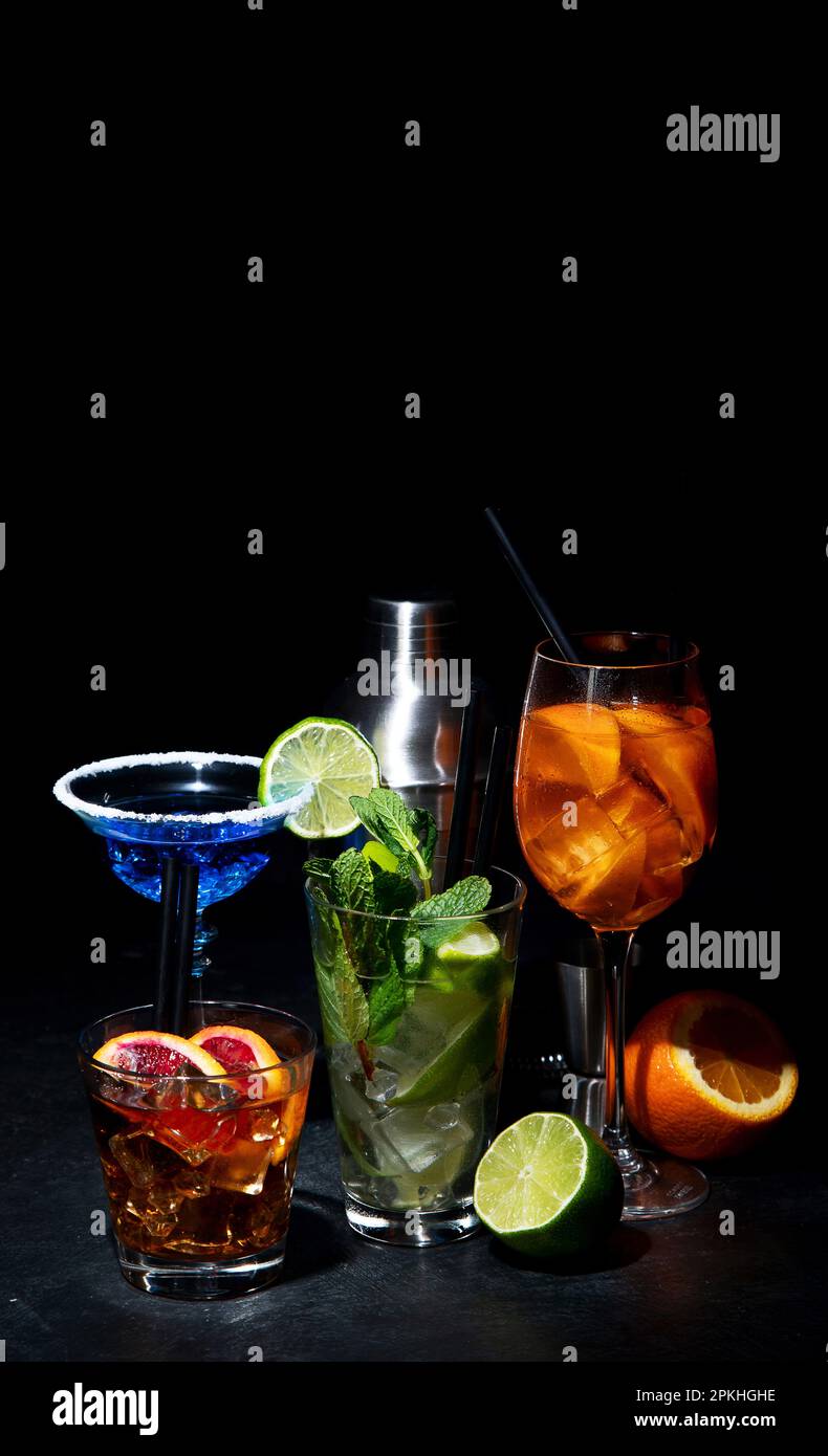 Set of various colorful cocktails on black background. Classic long ...