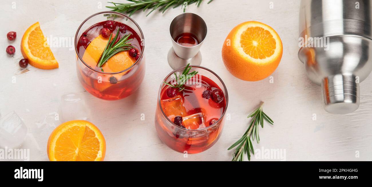Different delicious cocktails on table. Alcoholic coctail with fruit ...