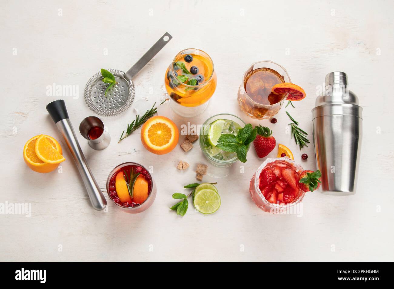 Different delicious cocktails on table. Alcoholic coctail with fruit ...