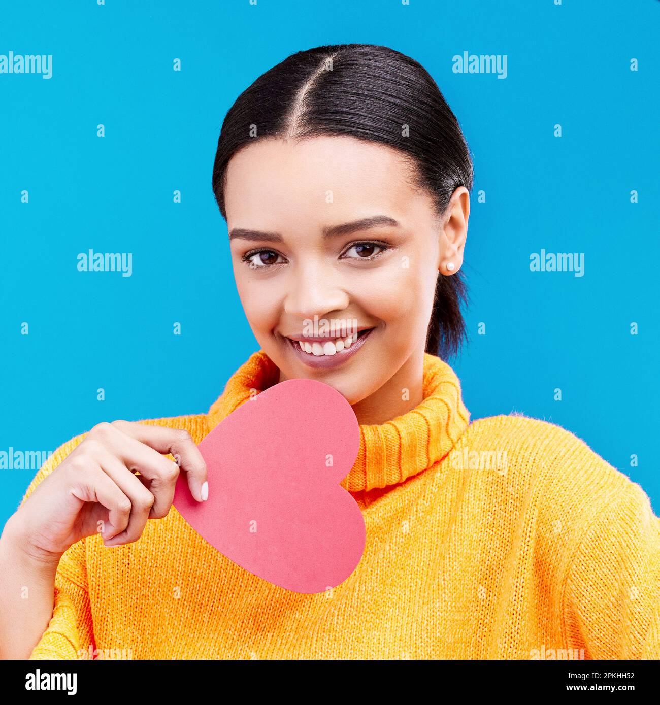 Paper heart, portrait and happy woman on blue background, love icon and ...