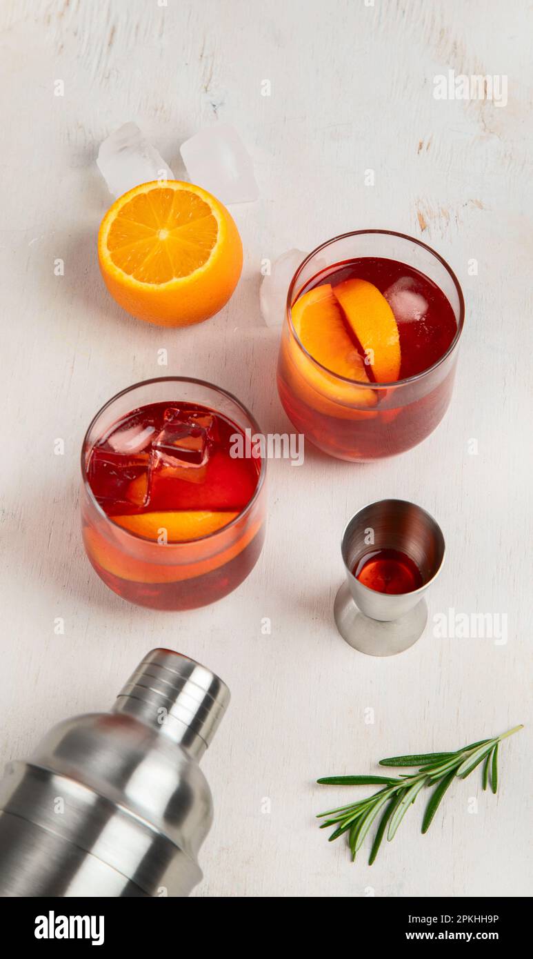 Different delicious cocktails on table. Alcoholic coctail with fruit ...