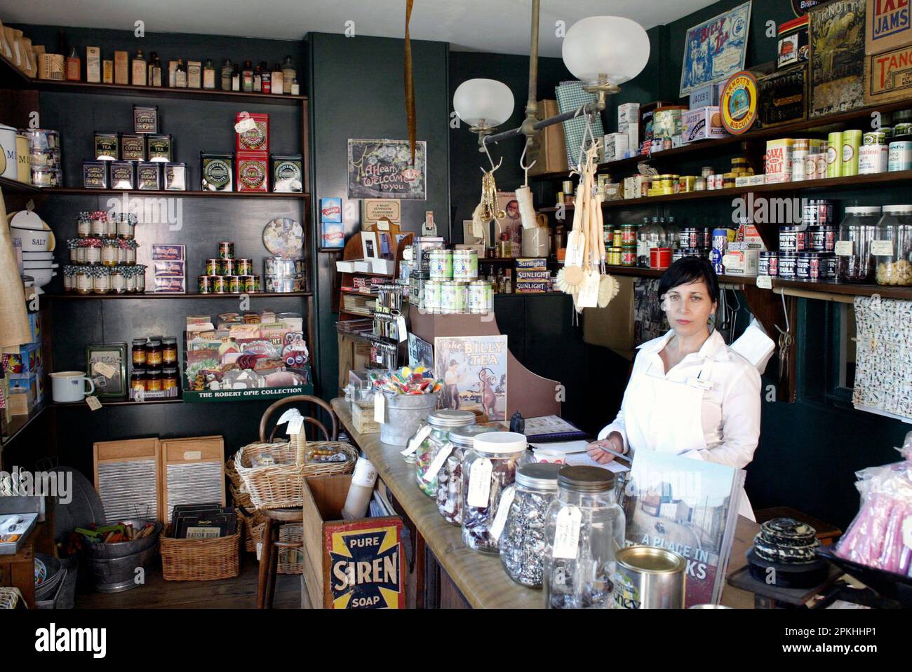 A museum curator serves as a shopkeeper in Susannah Place, replicating ...
