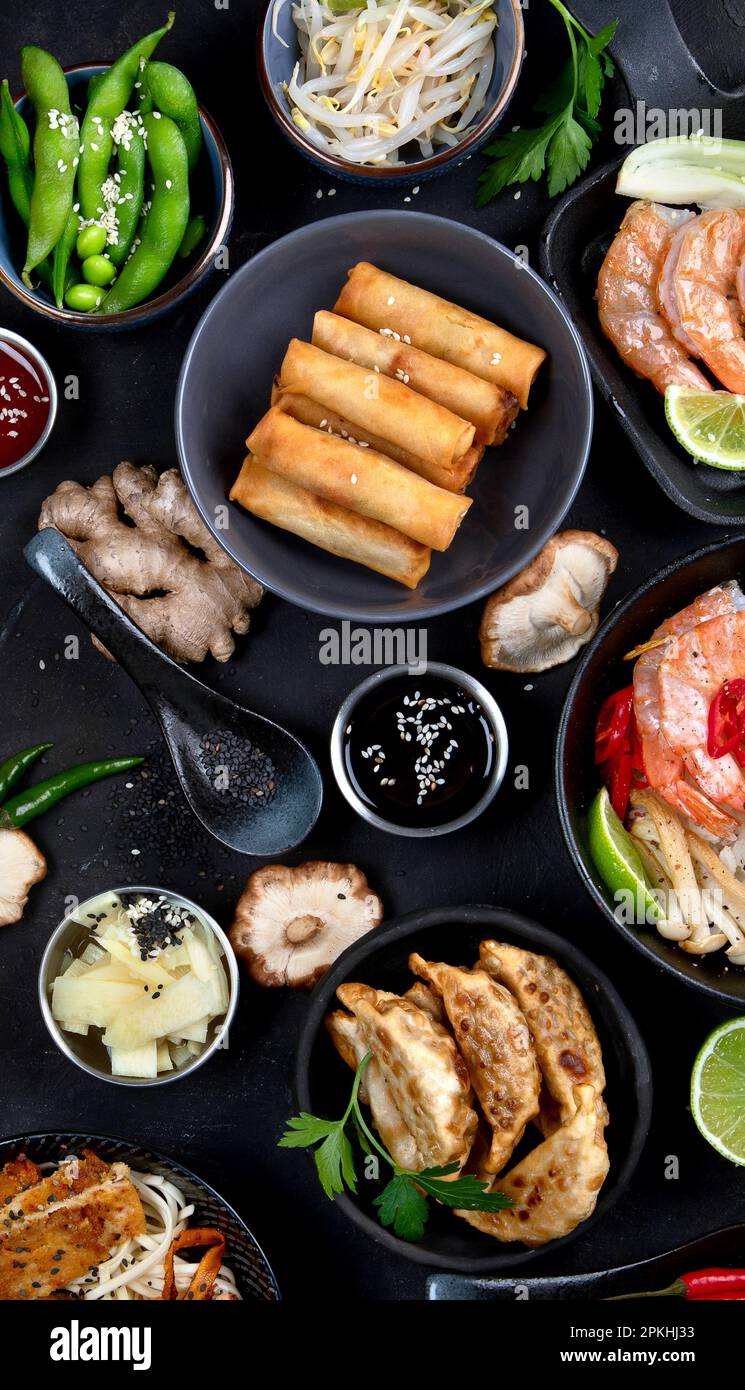 Various asian meals dishes on black background , top view. Asian food ...