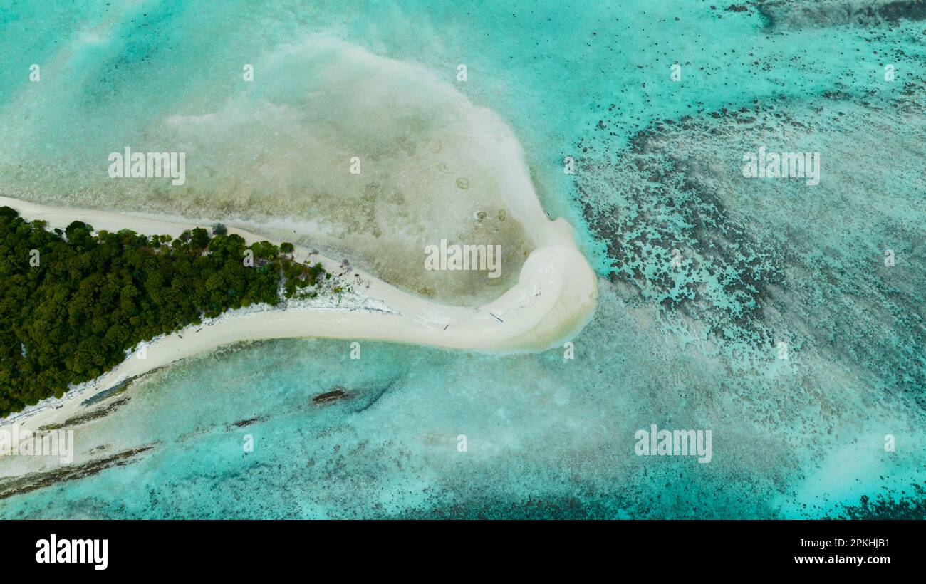 Aerial view of tropical island Mataking with coral reef and atoll view ...