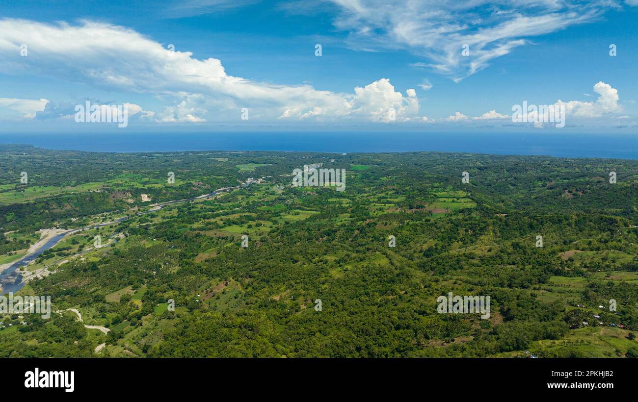 Rural area with agricultural land and rice fields in the tropics ...