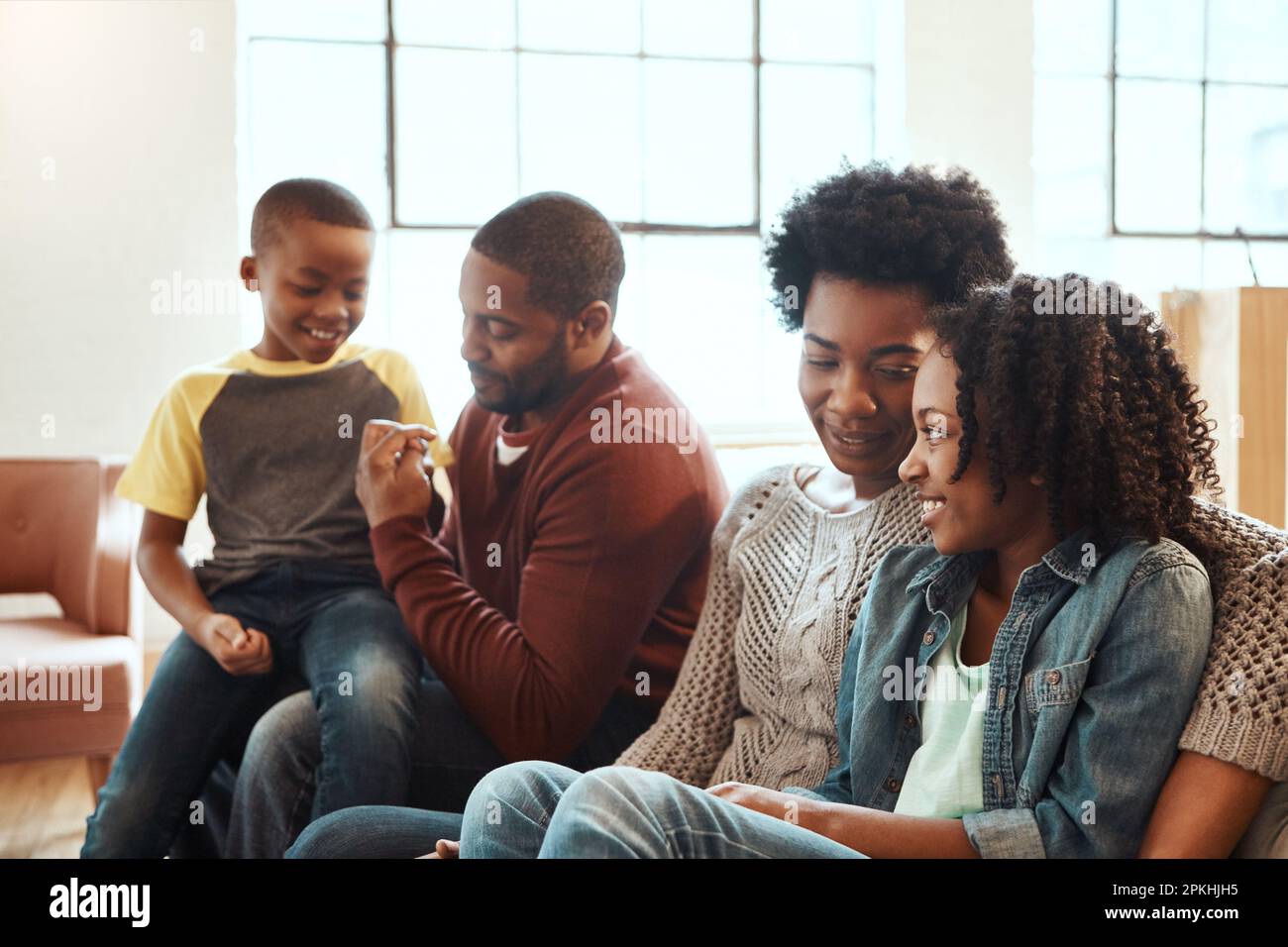 Our family is all we need. a family having fun indoors Stock Photo - Alamy