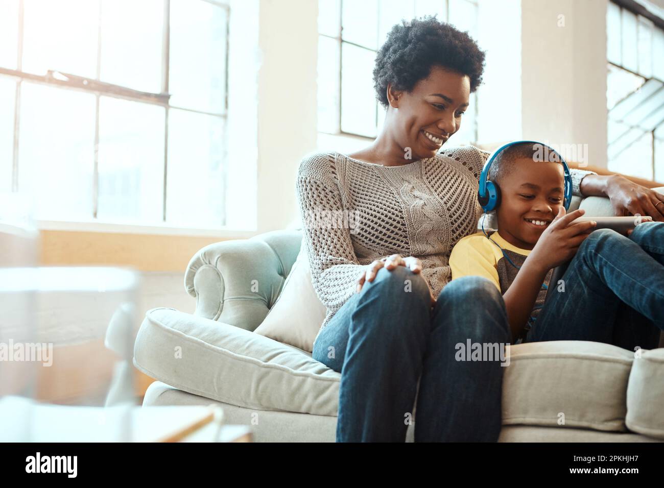 With music I discovered his interests. a mother and son using a tablet ...