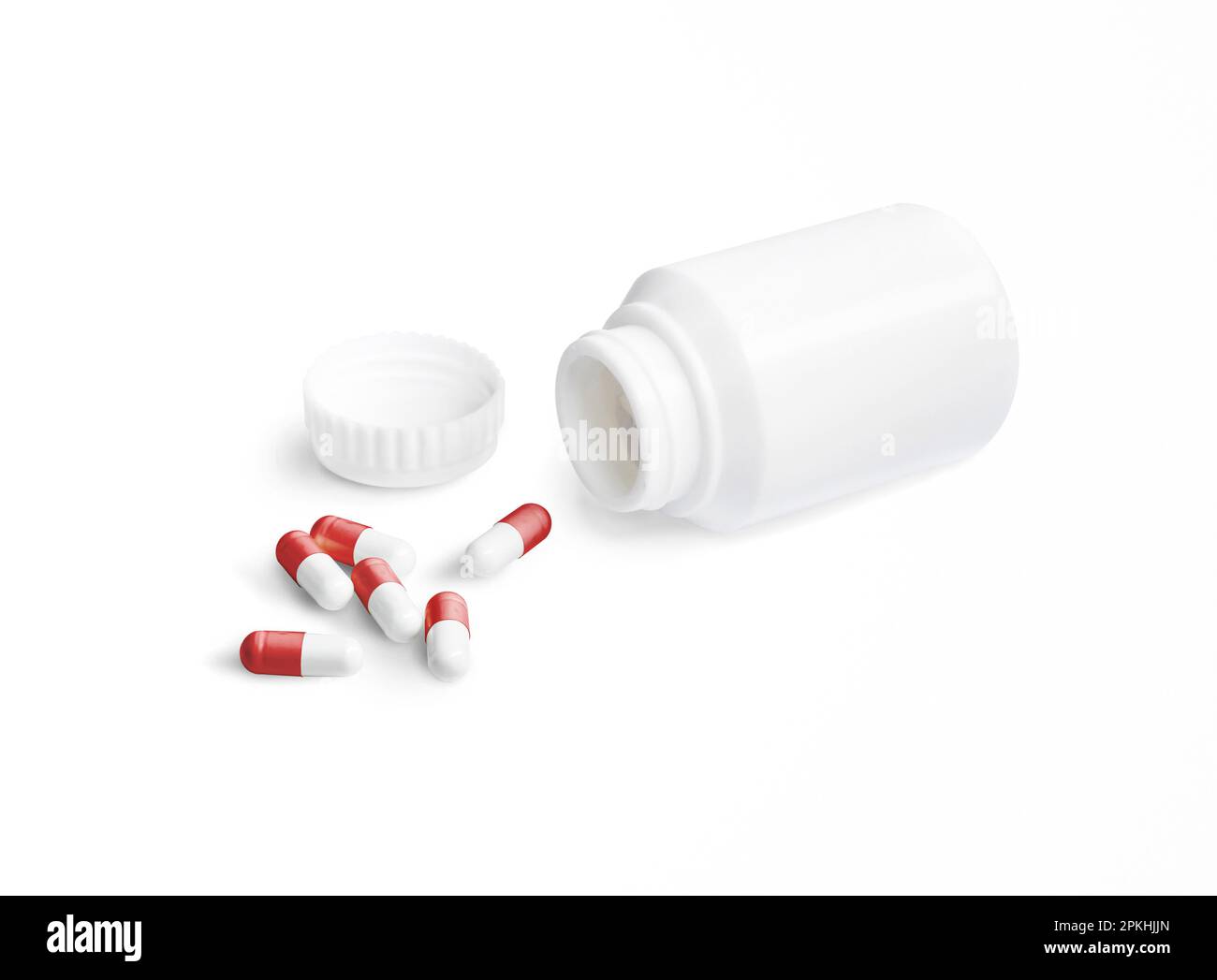 Capsule pills with red and white spilling out of pill bottle on white ...