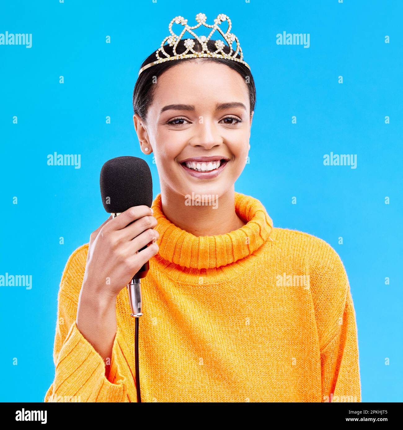 Woman, crown and microphone in studio portrait with smile for singing ...