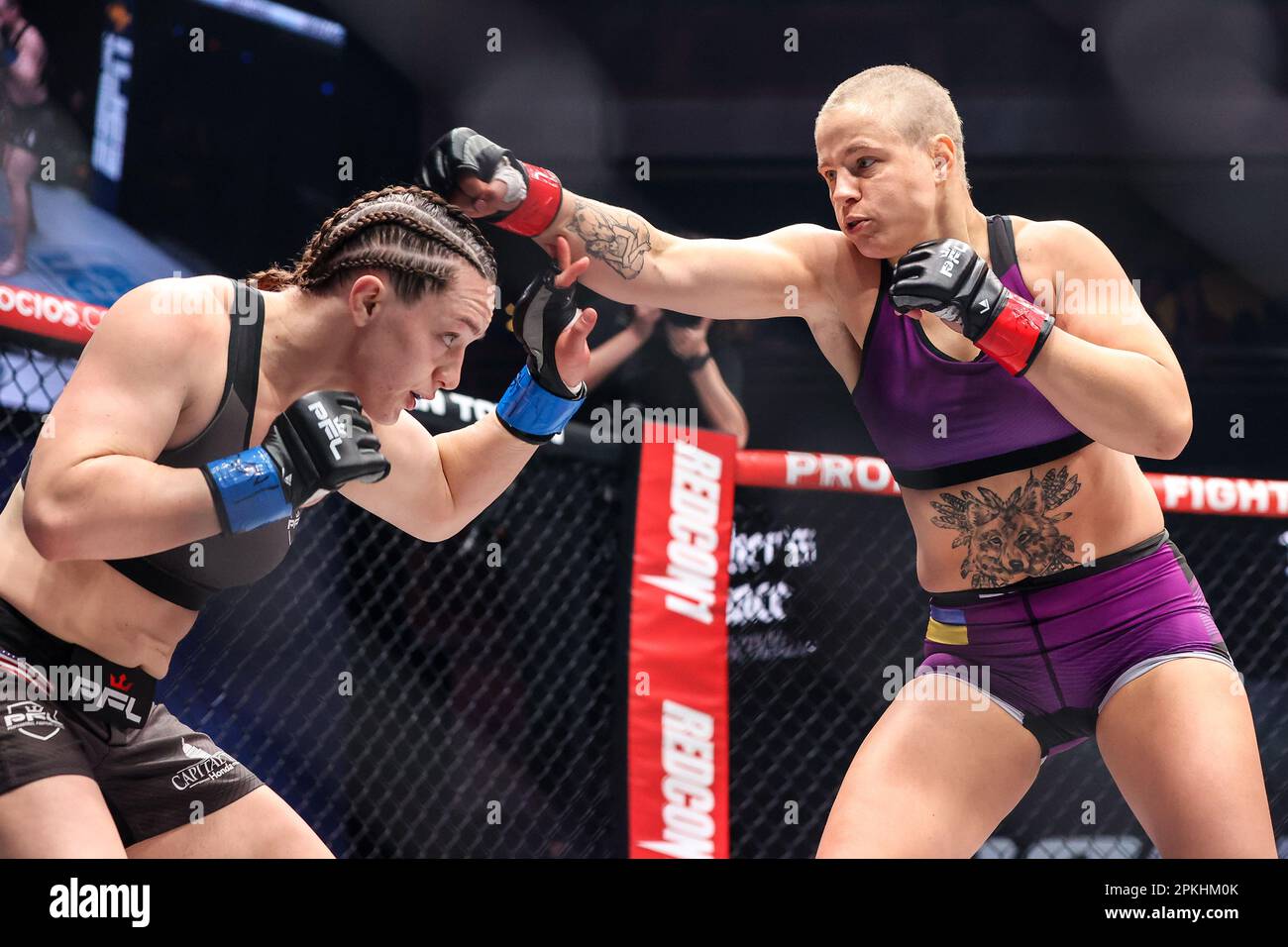 April 7, 2023: (L-R) Featherweight Aspen Ladd ducks under a punch by Olena Kolesnyk during their ...