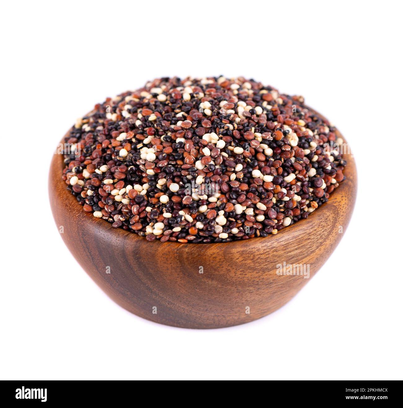 Quinoa seeds in wooden bowl, isolated on white background. Mix of white ...