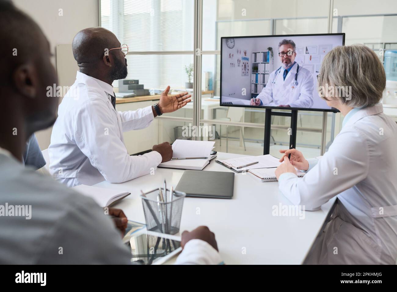 Diverse doctors having video conference hi-res stock photography and ...