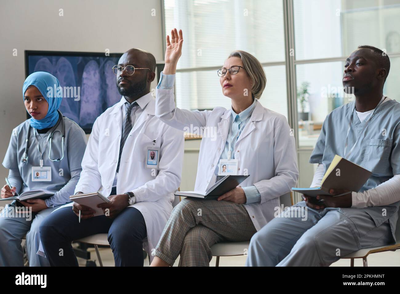 Mature woman asking questions doctor hi-res stock photography and ...