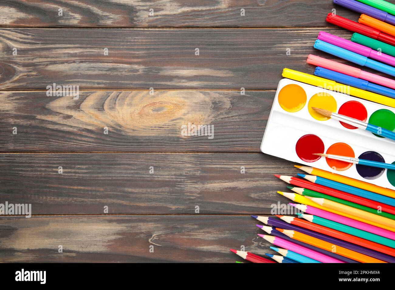 School supplies on brown wooden background. Back to school. Flat lay ...