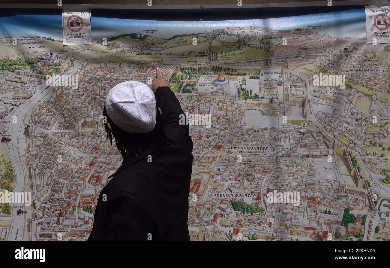 JERUSALEM, ISRAEL - APRIL 7: Muslim tourists look at the map of the old ...