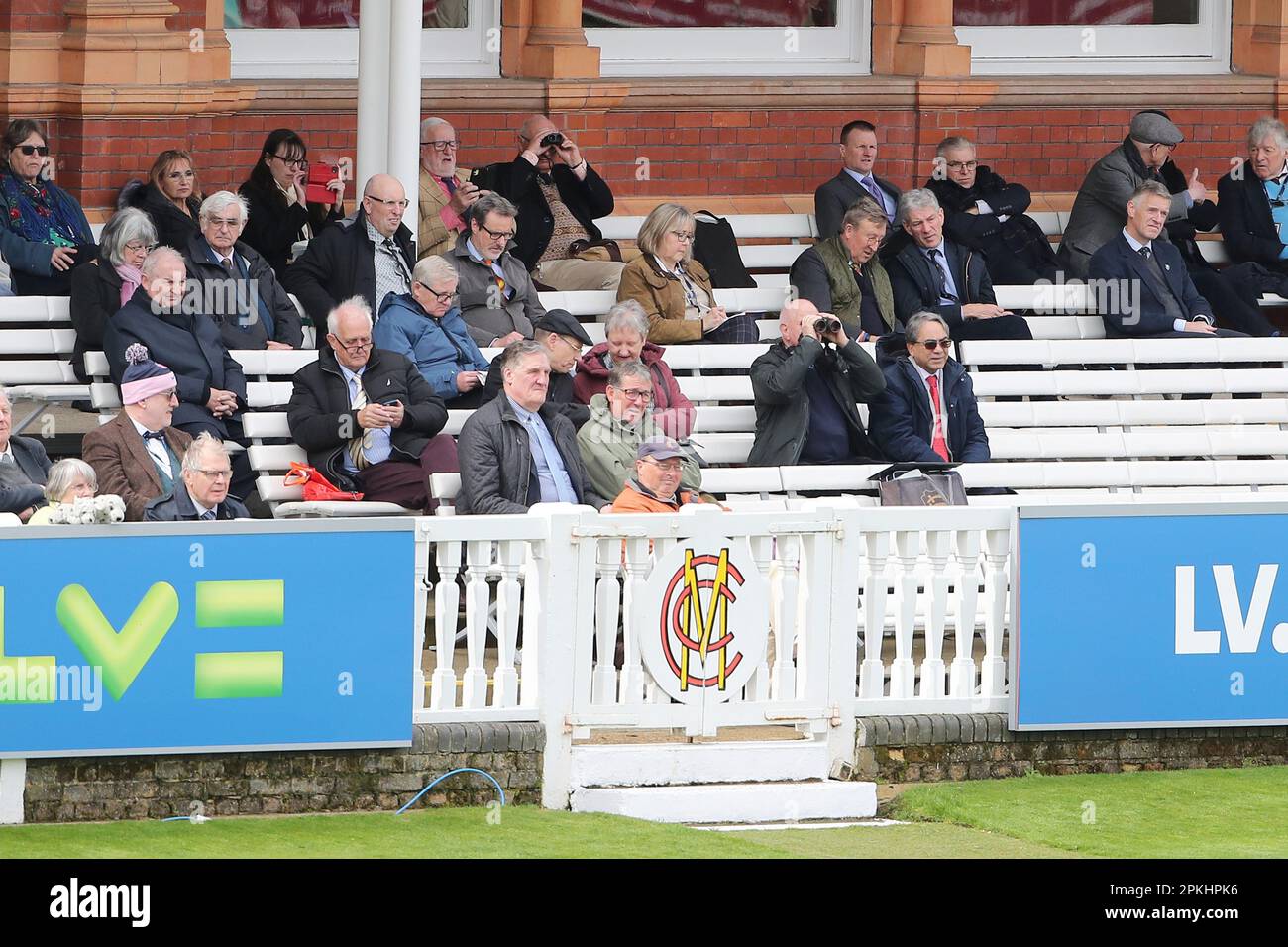 Members look on from the pavilion benches during Middlesex CCC vs Essex ...