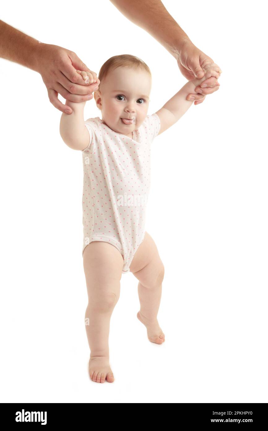 Smiling child walking hand in hand with father on white background ...
