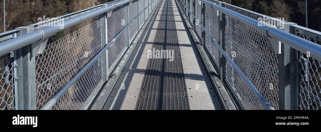 Pedestrian suspension bridge with perforated metal sheet, expanded ...