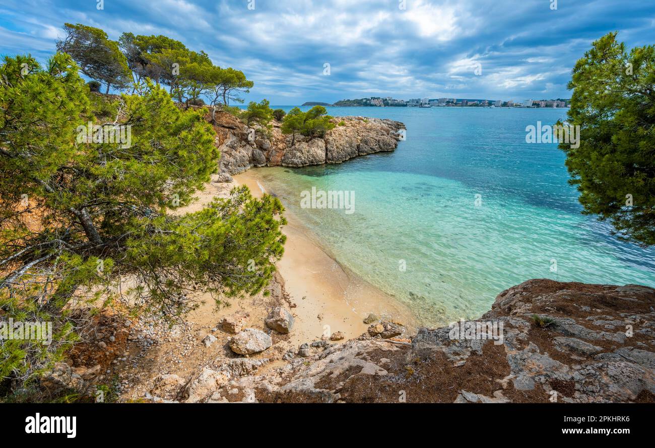 Small bay with sandy beach and blue sea, Cala Punta Negra, Badia de ...