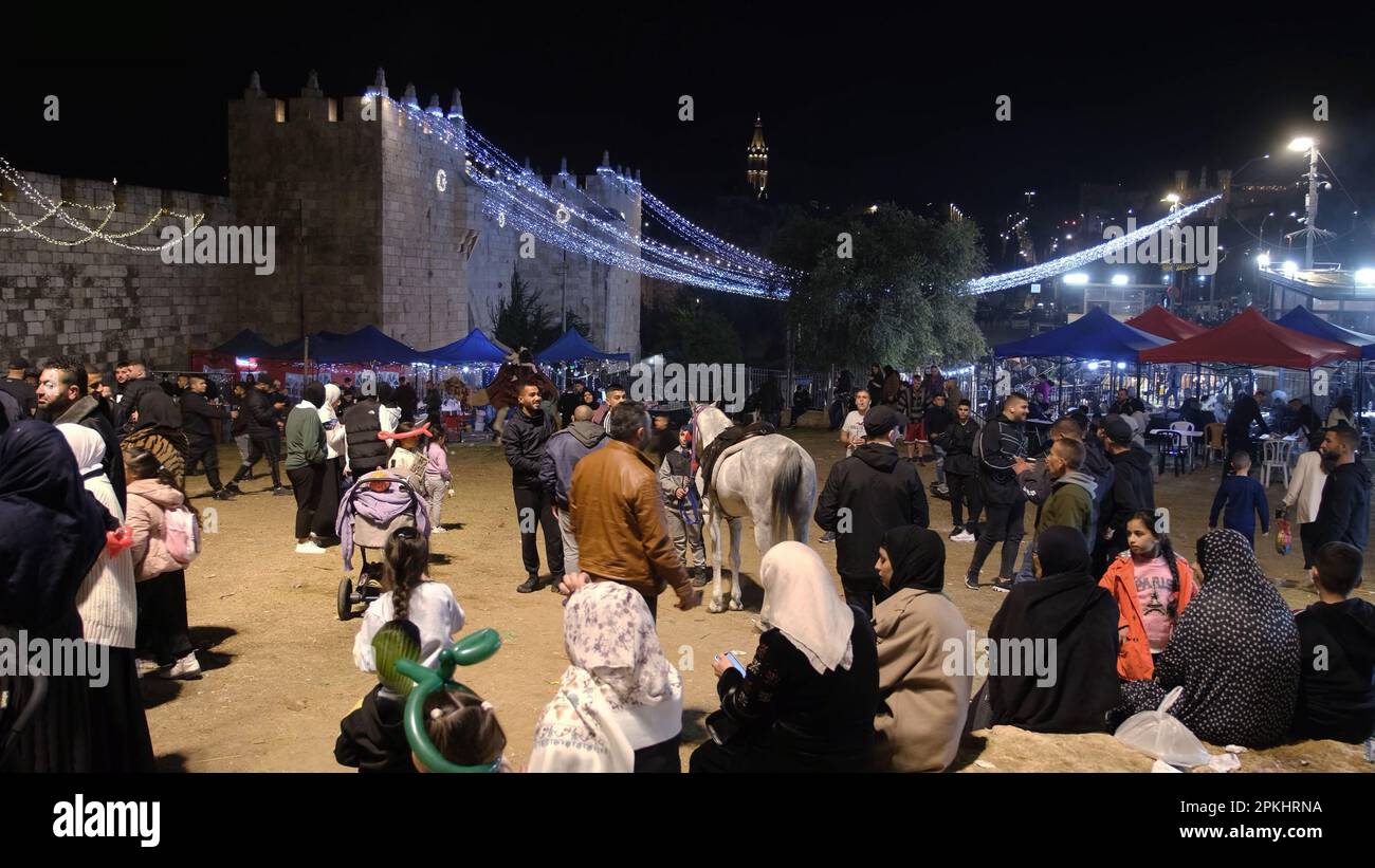Palestinians gather in front of Damascus Gate after the break of ...