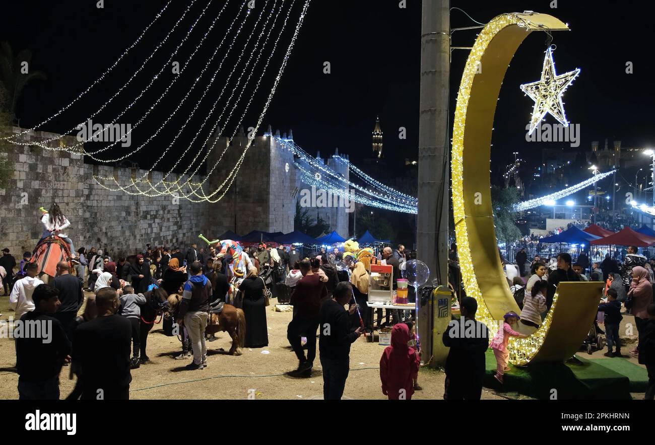 Palestinians gather in front of Damascus Gate after the break of ...