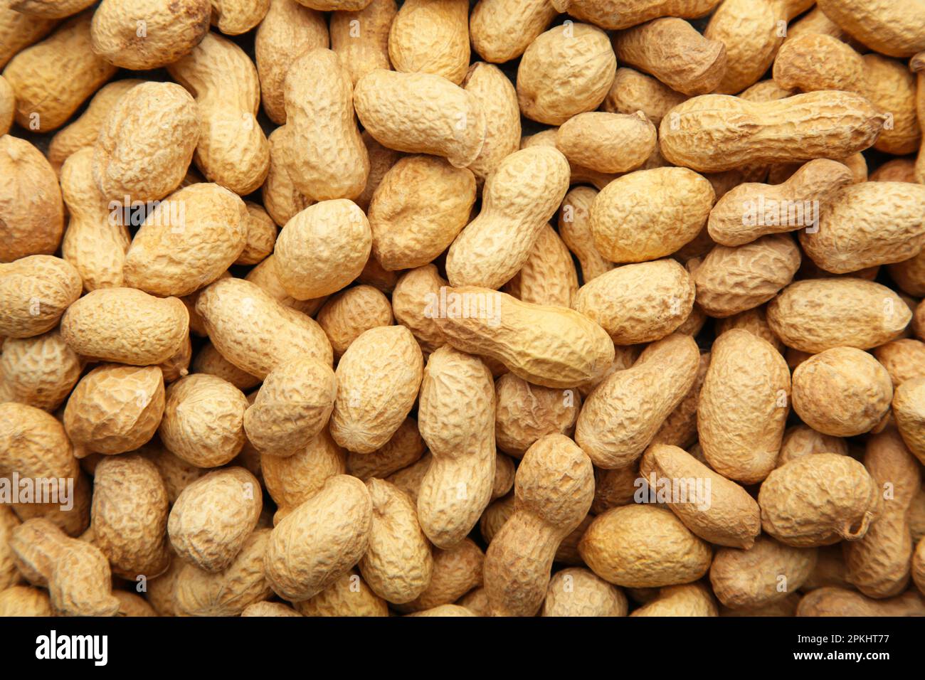 Many peanuts in shells background. Food texture. Top view Stock Photo ...