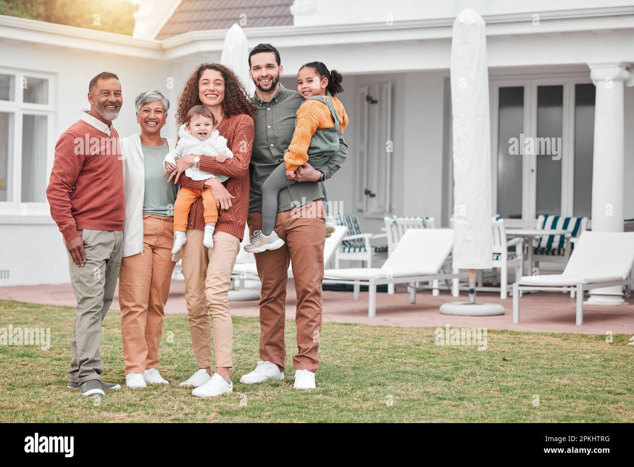 Family, generations and happiness in portrait at holiday home ...