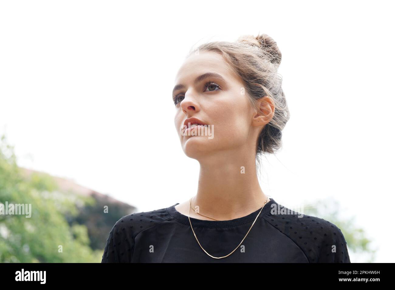young woman gazing absentmindedly into the distance Stock Photo - Alamy