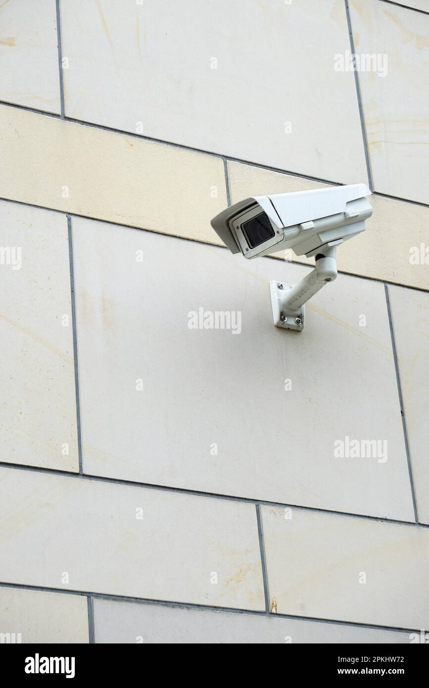 security or surveillance camera on building exterior Stock Photo - Alamy
