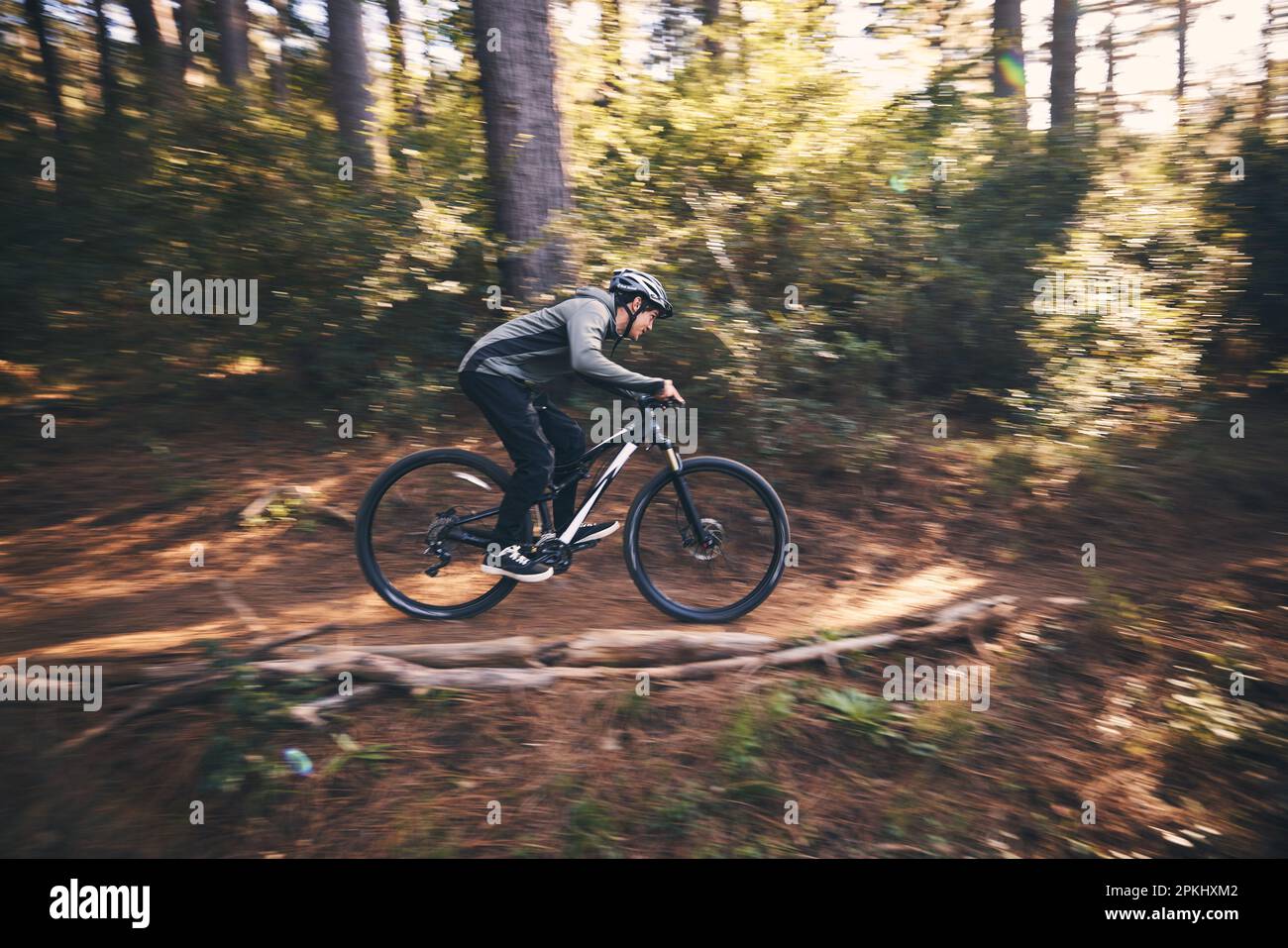 Man, outdoor and cycling in nature for sports, exercise or training on ...