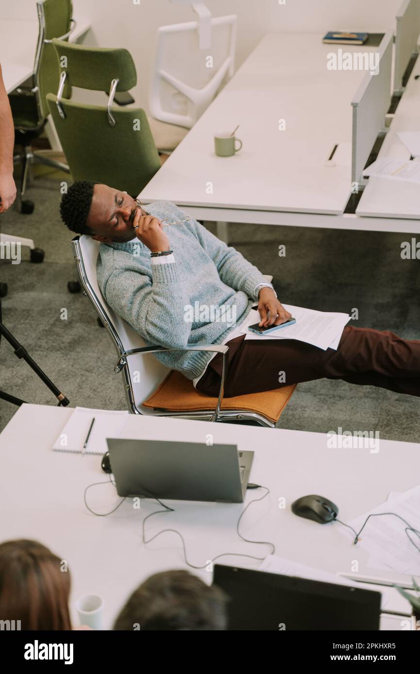 After rough day at work, young black male decided to take a nap Stock ...