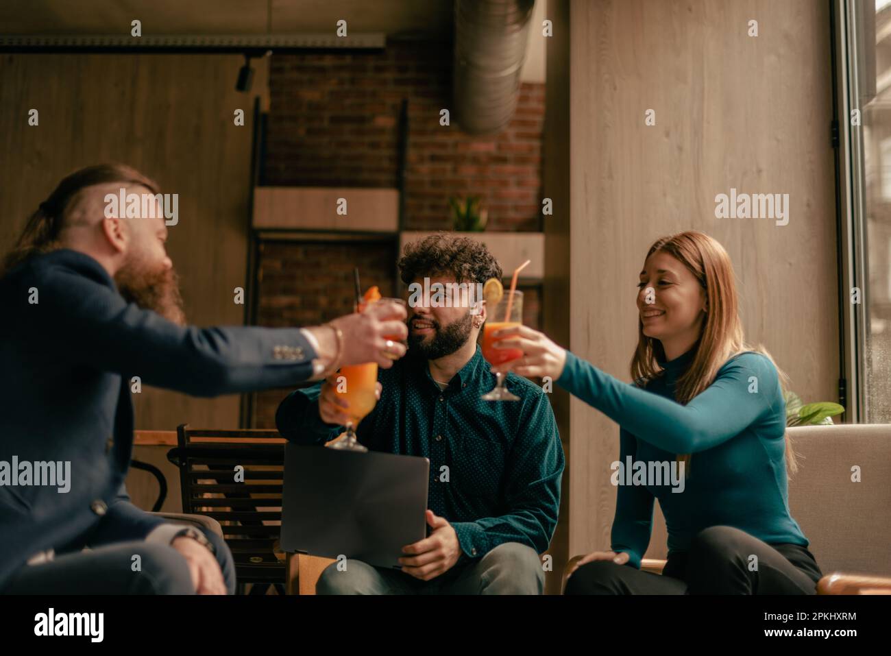 Three friends being happy and smiling, cheering to something at the ...