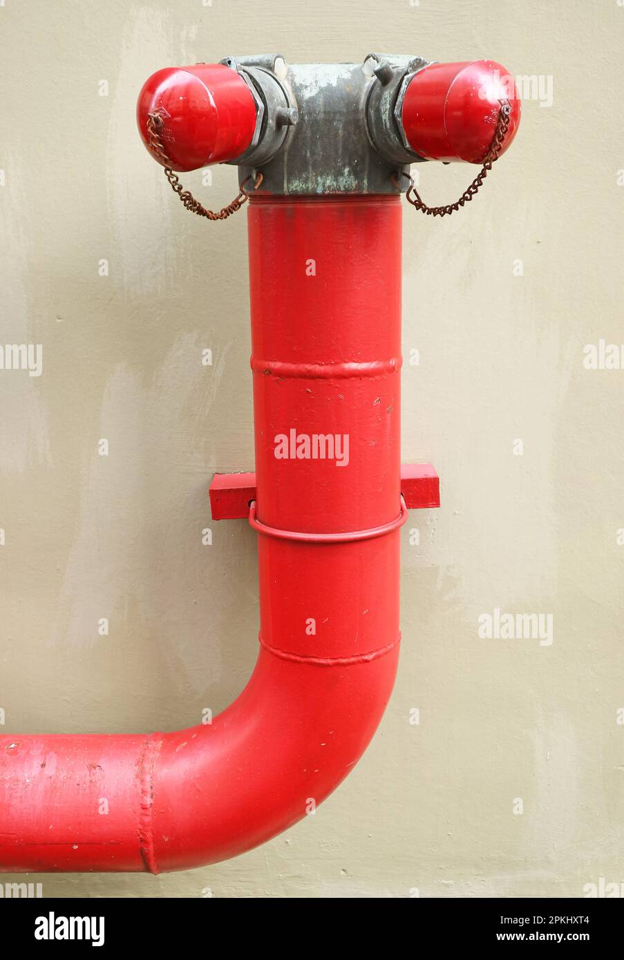 Vivid red fire hydrant on the concrete wall Stock Photo - Alamy