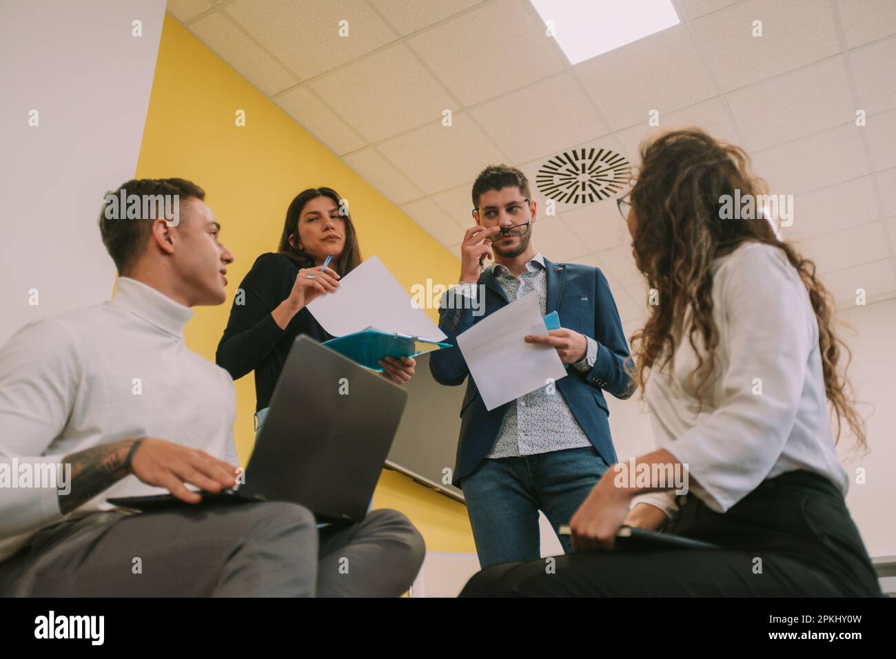 Office interior a group of four people hi-res stock photography and ...