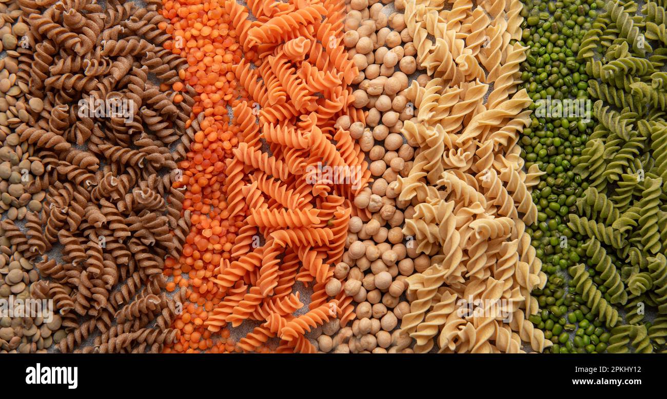 A variety of fusilli pasta made from different types of legumes, green ...