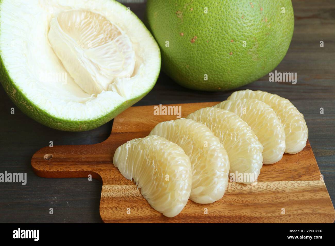 Row of Peeled Fresh Pomelo Segments with Opened in Half and Whole Fruit ...
