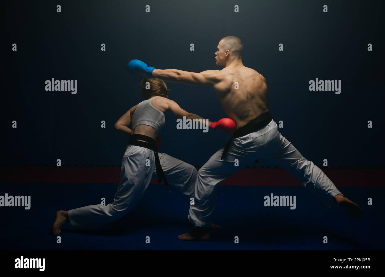 Two karate friends fight and doing some karate pose at the studio Stock ...