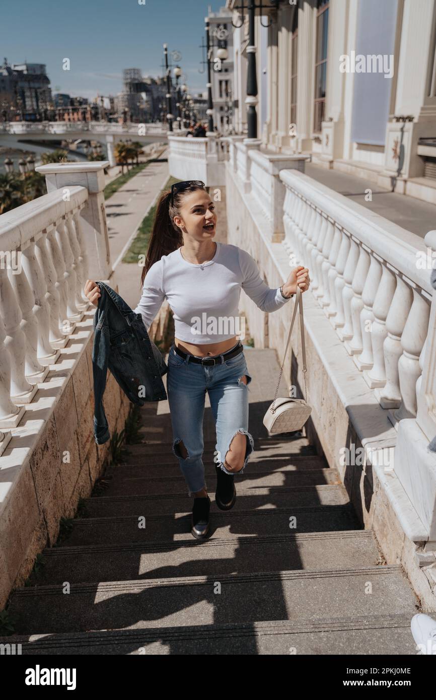 Teen girl walking up stairs hi-res stock photography and images - Alamy