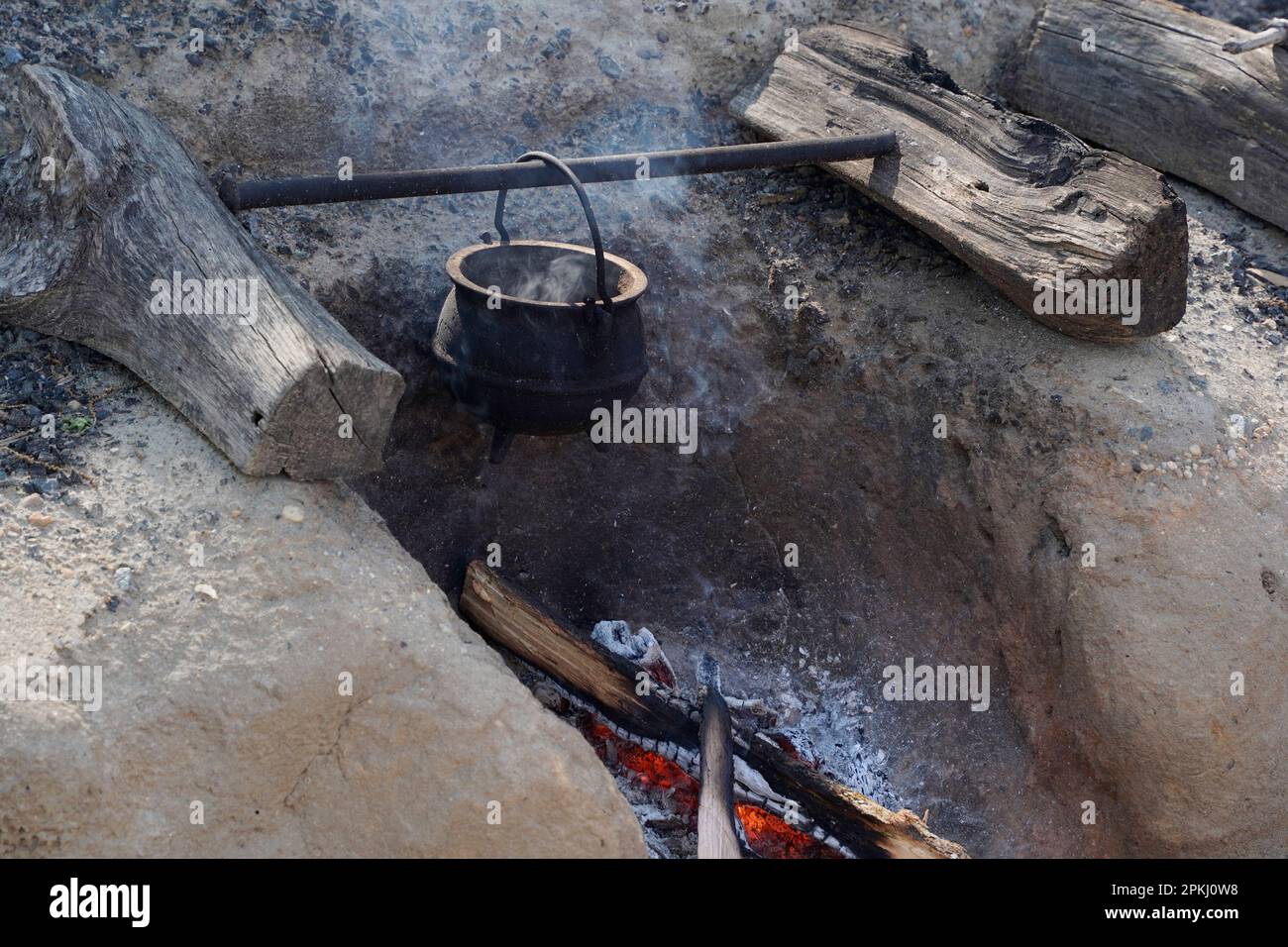 Water boiling on fire in camp of American Revolution british soldier ...