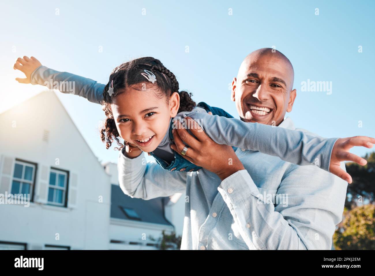 Family, portrait and father lifting girl in air for garden bonding ...