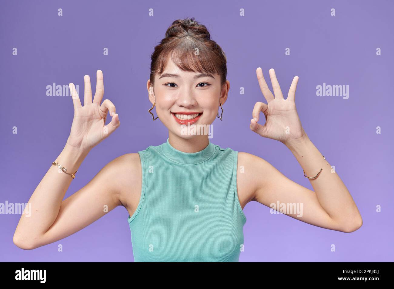 Portrait happy Asian woman shows ok sign looking at camera Stock Photo - Alamy