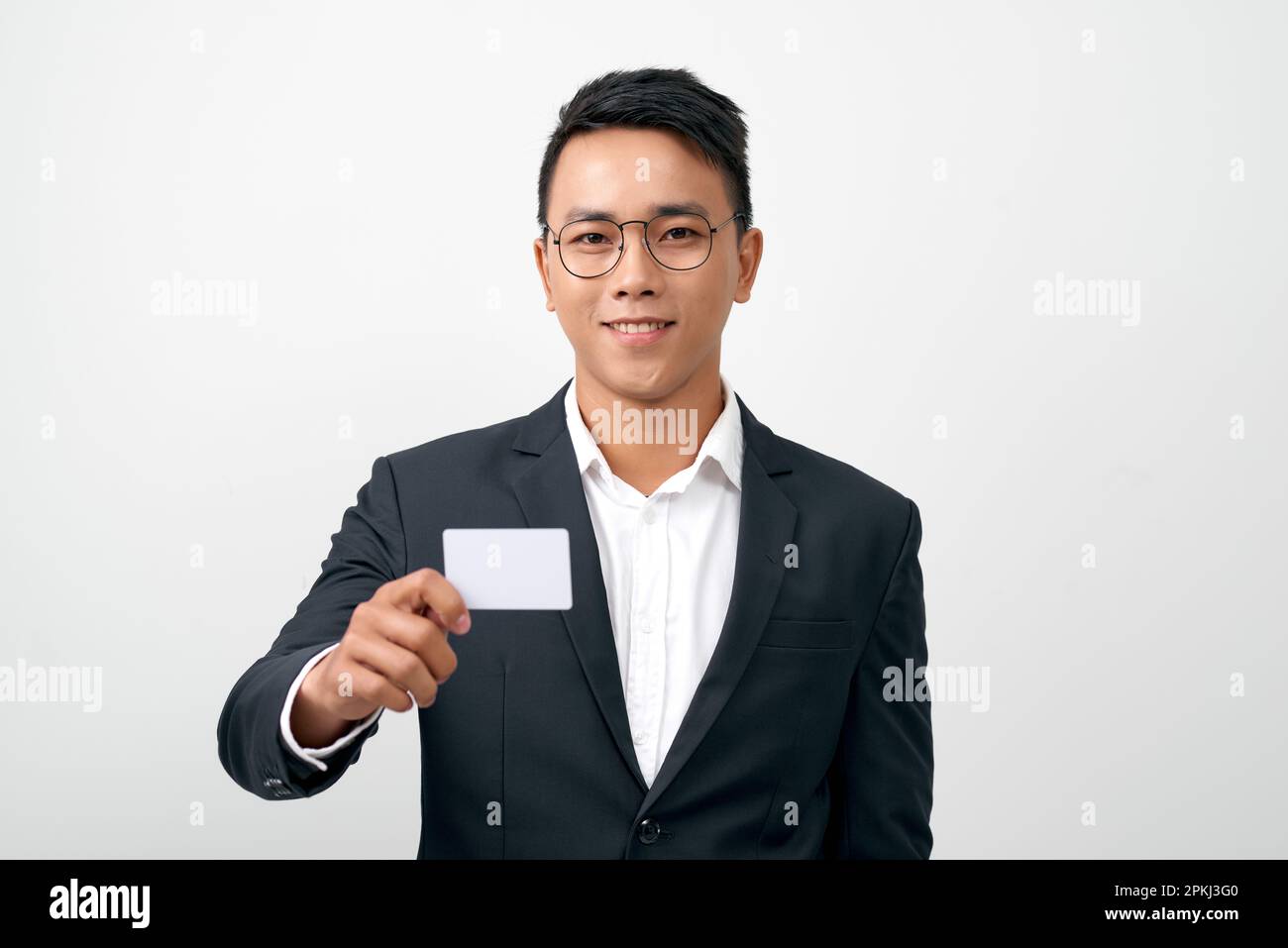 Photo of stylish handsome young man holding credit card isolated on ...