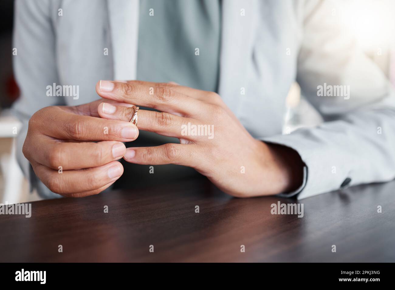 Woman taking off wedding ring hi-res stock photography and images - Alamy