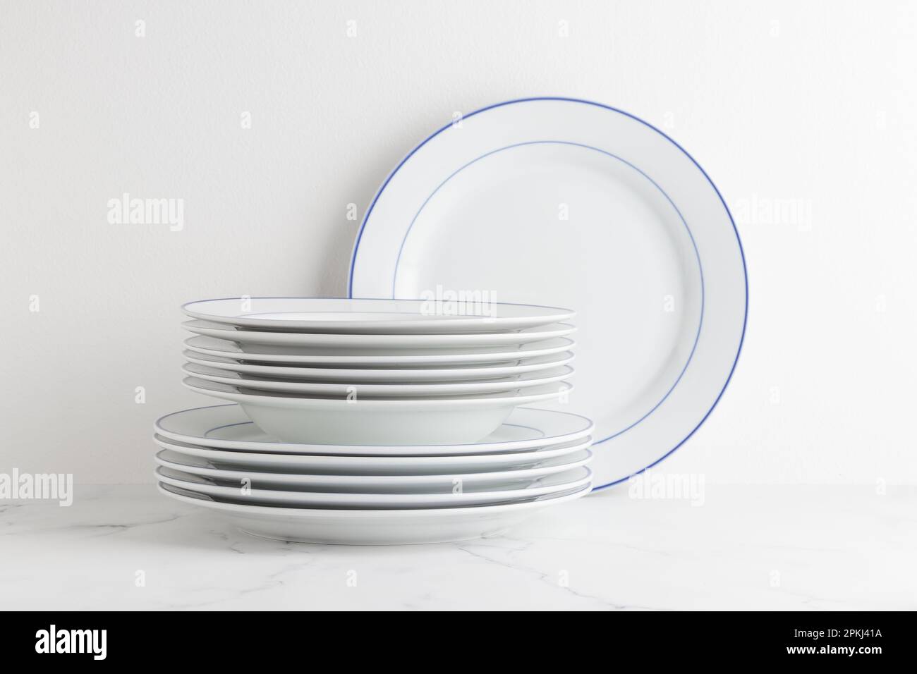 Clean white dinner set of plates on a white background Stock Photo - Alamy