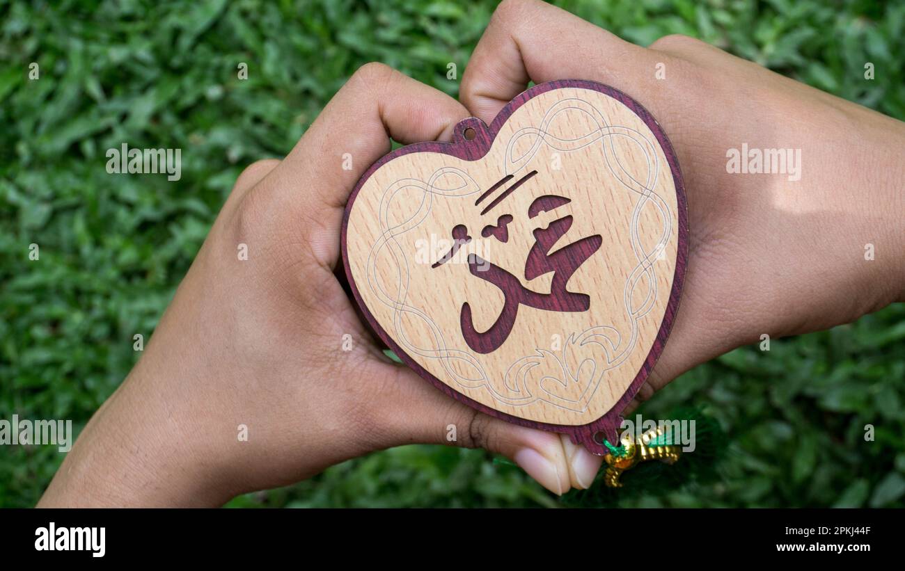 Muhammad: Muslim Woman's Hands Holding Heart-Shaped Tag with English ...
